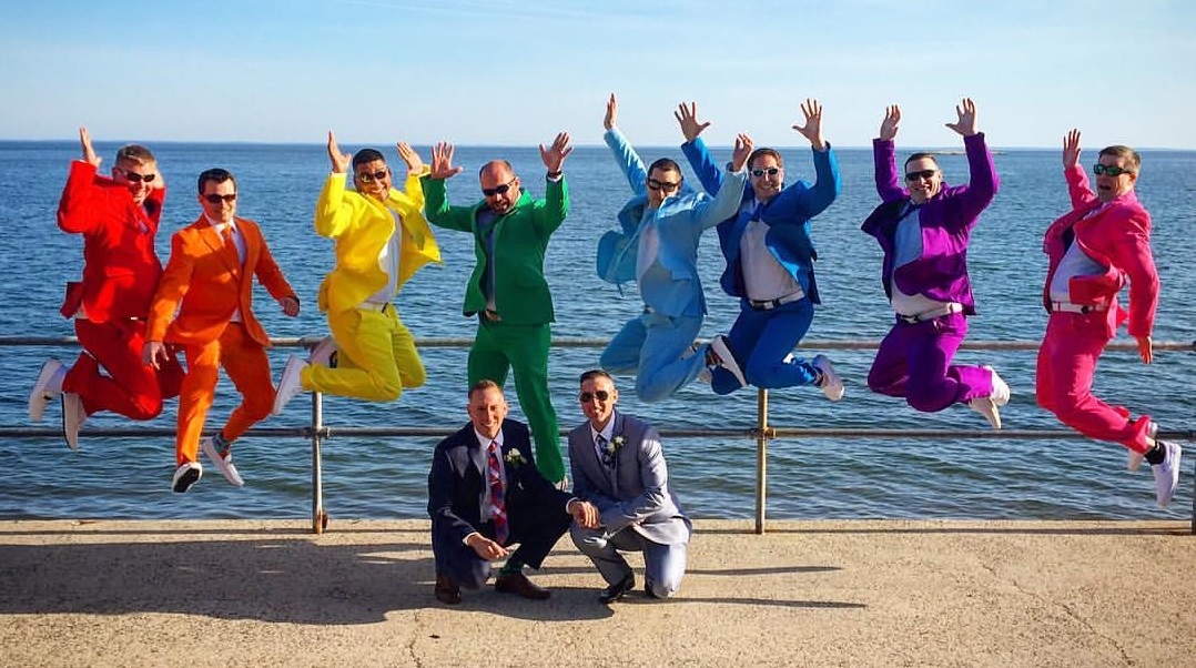 Grooms shocked by friends’ epic rainbow suits for their wedding day ...